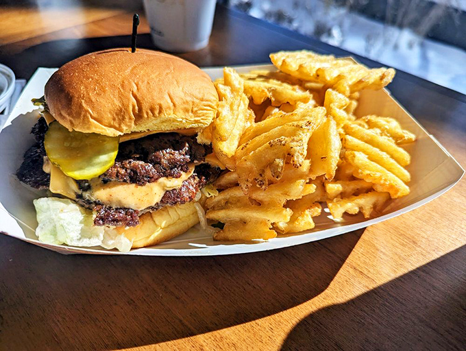 The Smash'd Mac arrives with waffle fries standing at attention like crispy golden soldiers. This isn't just comfort food&mdash;it's comfort food that gives you a warm hug.