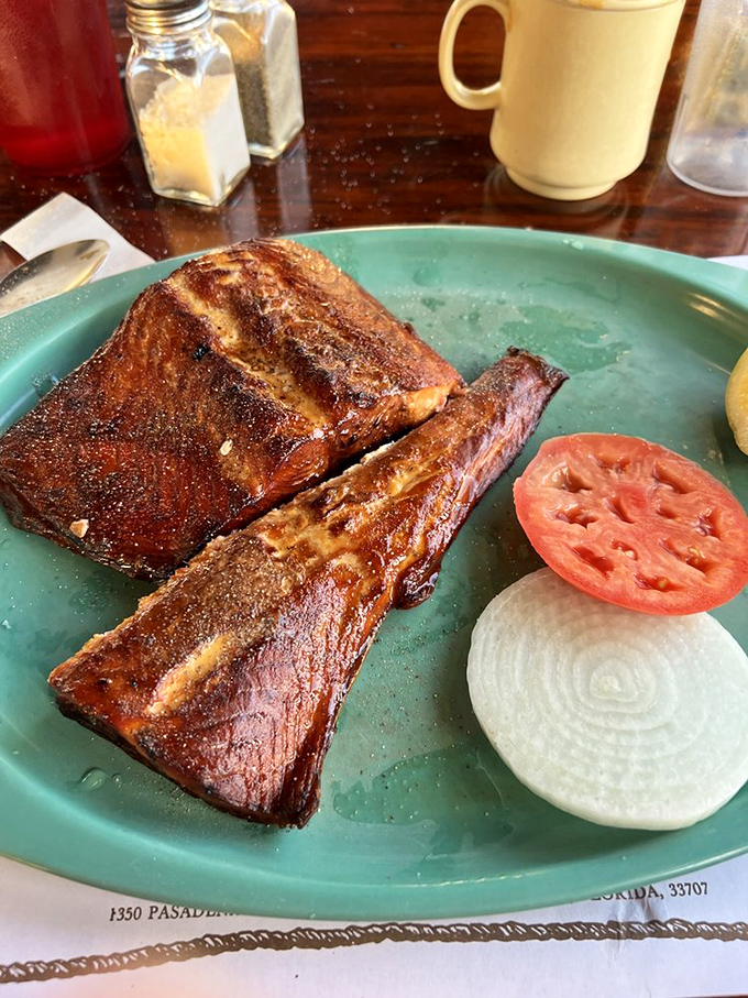 This isn't just smoked salmon; it's a master class in patience. That amber-hued fish with perfect flake is Florida's answer to culinary nirvana.
