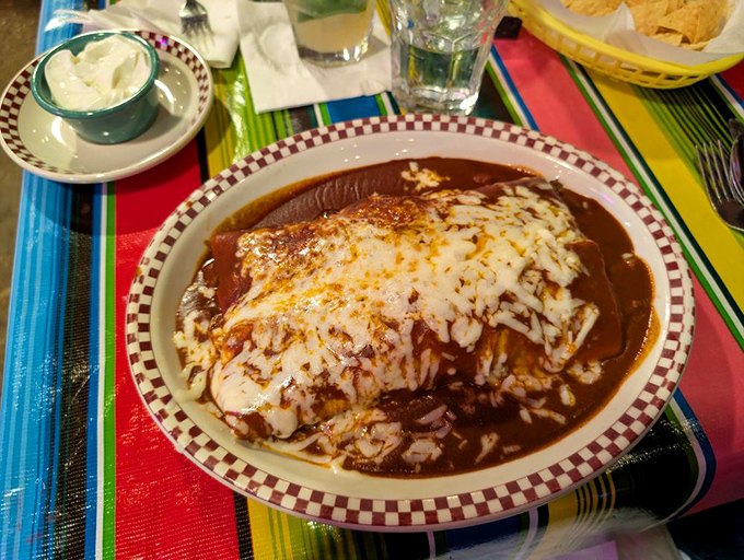 These enchiladas aren't just covered in mole&mdash;they're embraced by it, a warm chocolate-hued blanket of complex flavors that dance across your palate.