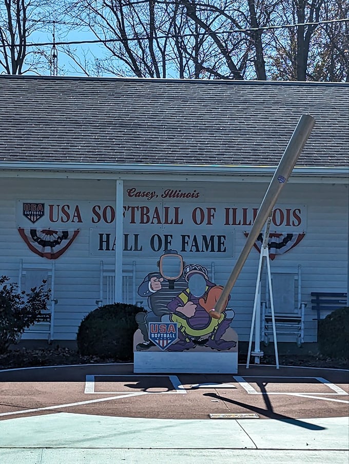 Batter up! Casey's love affair with softball reaches hall-of-fame status, complete with a bat so large it would give Paul Bunyan batting practice jitters.