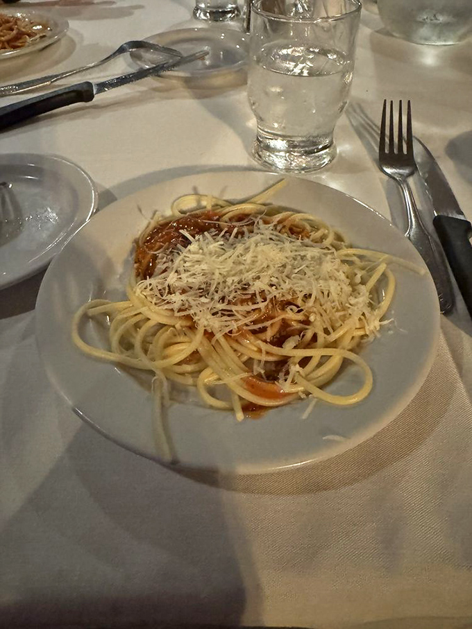 The complimentary pasta isn't an afterthought but a proper opening act, with that homemade sauce demanding a supporting role in your dinner conversation.