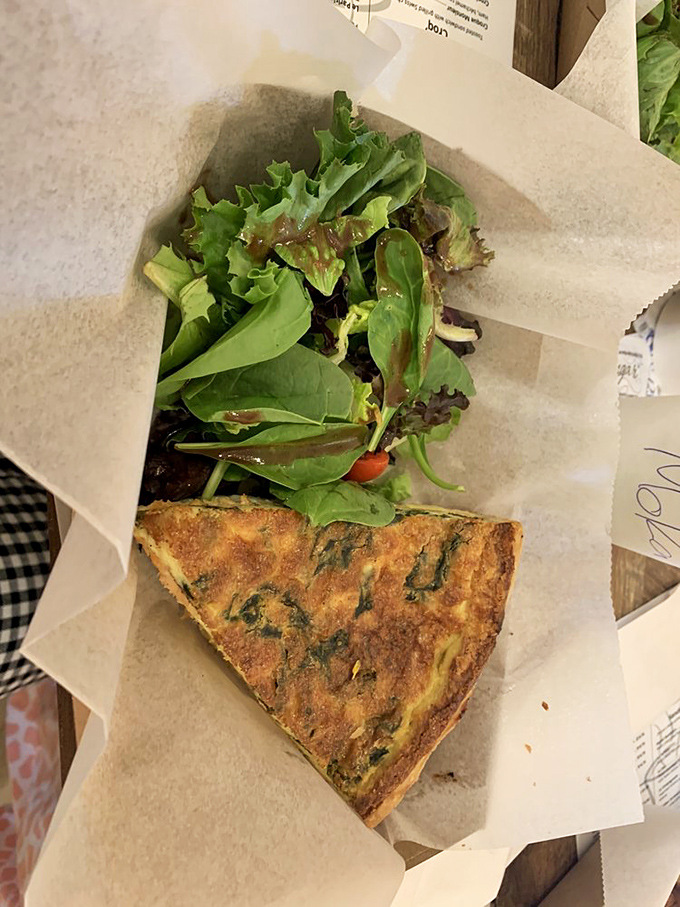 This spinach and salmon quiche isn't just breakfast&mdash;it's edible architecture with layers of flavor and a side of fresh greens.