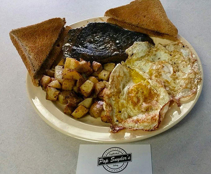 Breakfast perfection doesn't need to be complicated. Two eggs, home fries, toast, and a slab of ham that means business.