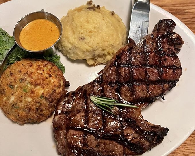 This isn't just dinner&mdash;it's a trilogy of deliciousness featuring a juicy steak, creamy mashed potatoes, and a crab cake that deserves its own fan club.