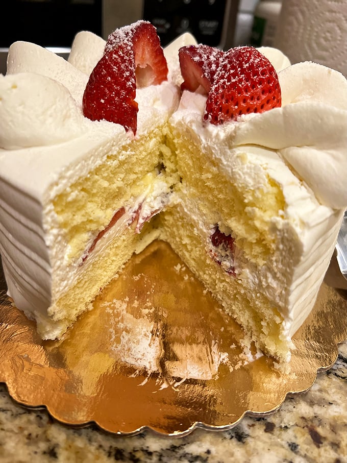 This strawberry cake isn't just dessert; it's architecture. Layers of sponge, cream, and berries in perfect structural harmony.