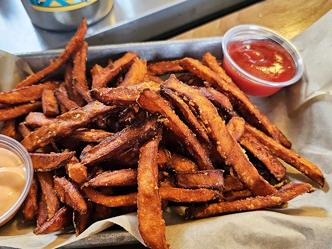Sweet potato fries that look like they've been kissed by the sun gods. That perfect crisp-to-fluff ratio is what potato dreams are made of.