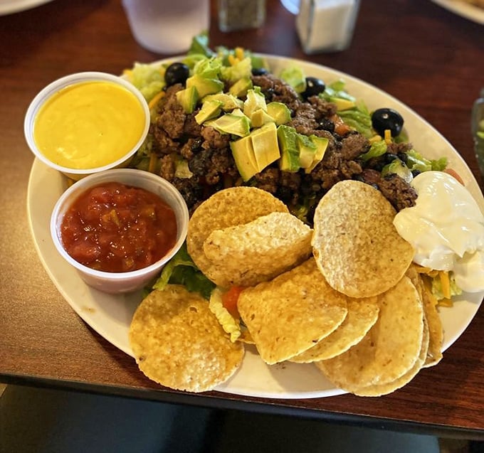 This isn't just a taco salad; it's a fiesta on a plate. Crispy tortilla chips, seasoned beef, and fresh toppings create the perfect edible bowl.