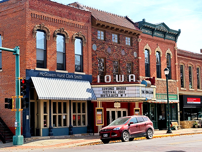 The Iowa Theater's vintage marquee promises entertainment the old-fashioned way&mdash;no algorithms suggesting what to watch, just community consensus on what's worth seeing.