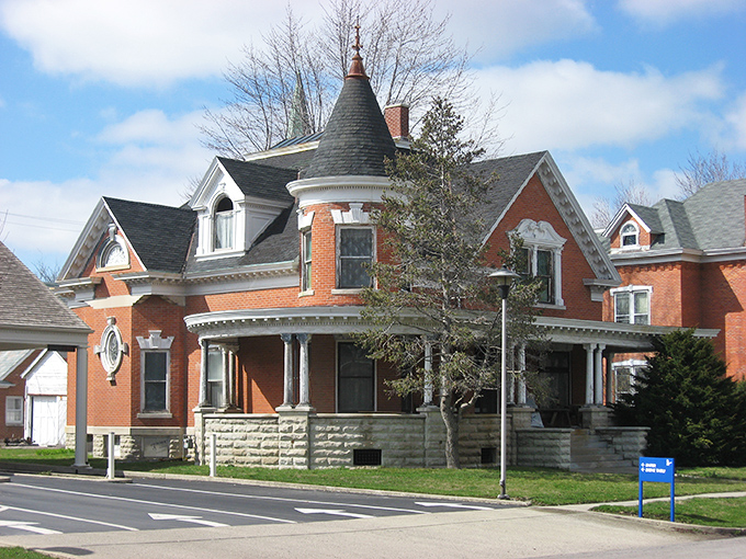 This Queen Anne Victorian beauty could make HGTV hosts weep with joy. Red brick, ornate trim, and that tower&mdash;because everyone needs a proper spot for contemplating life's mysteries.