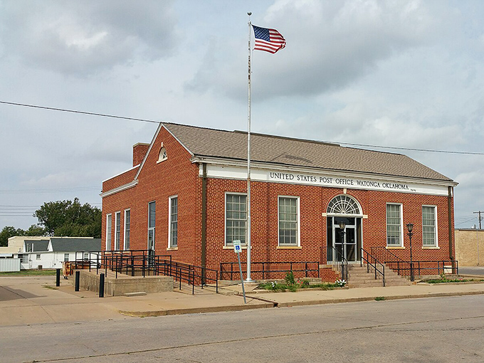 Watonga's stately brick post office serves as both mail hub and impromptu community center, where catching up with neighbors costs exactly nothing.