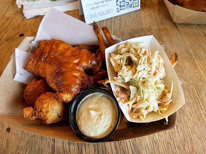 Golden-fried perfection meets creamy slaw in a platter that would make Captain Ahab forget all about that whale.