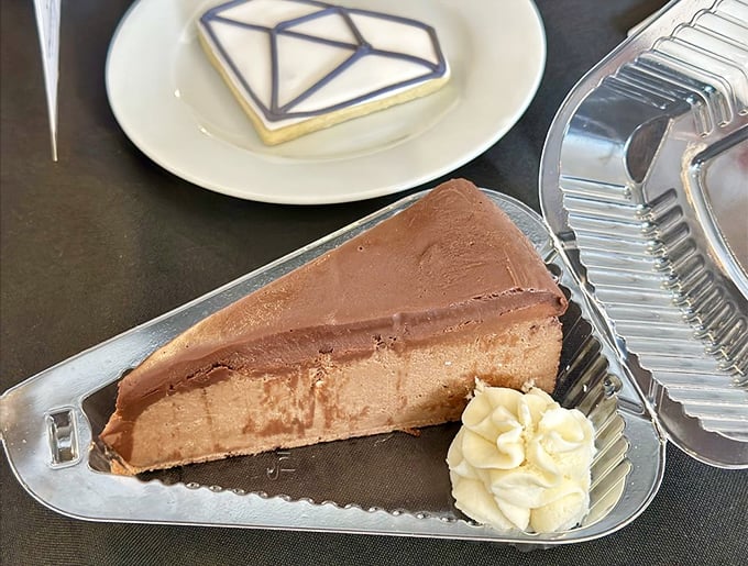 Triple chocolate cheesecake that doesn't just satisfy your sweet tooth&mdash;it throws a party for it. The dollop of whipped cream is just showing off.