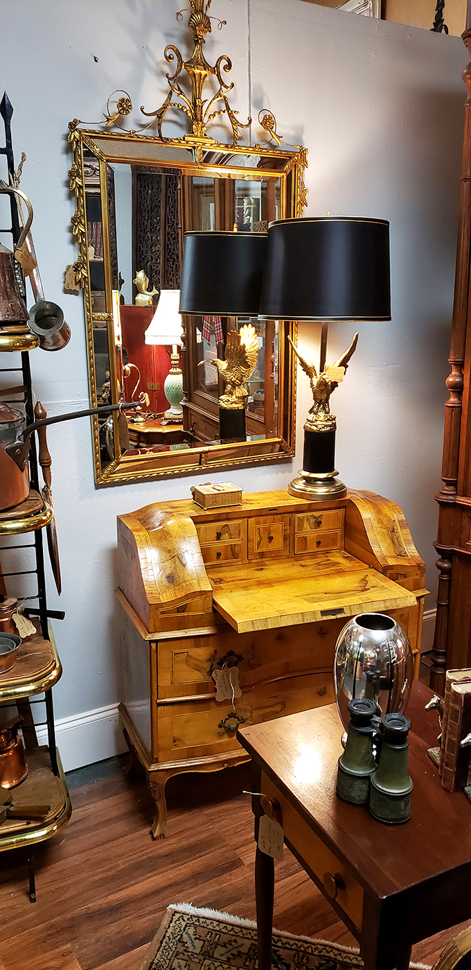 This isn't just furniture&mdash;it's a time machine with drawers. That eagle lamp looks ready to soar right off the desk with your credit card.