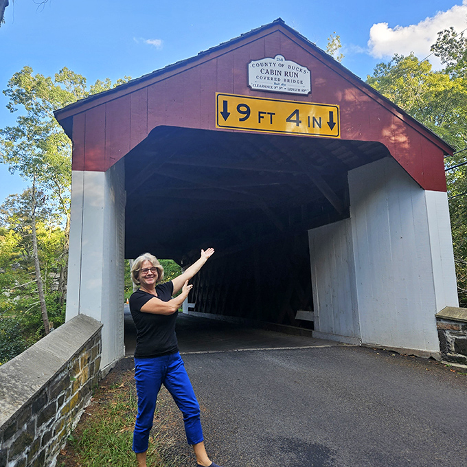 "How tall? This tall!" Visitors can't help but measure themselves against this historic landmark's 9-foot clearance sign.
