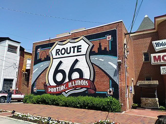 Nothing says "you've arrived somewhere special" like a giant Route 66 shield mural welcoming travelers to a town that embraces its place in American road trip lore.