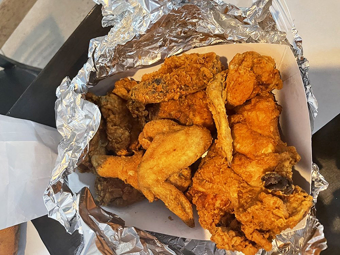 Golden-brown perfection in a box. This chicken isn't trying to impress anyone with fancy plating - it lets its crispy skin do all the talking.