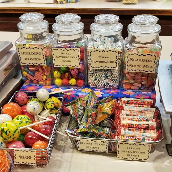 Candy architecture at its finest. These glass jars house the building blocks of childhood joy, no construction permit required.