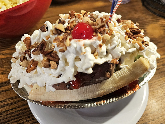 Not all heroes wear capes, but this banana split wears whipped cream, nuts, and a cherry crown fit for dessert royalty.