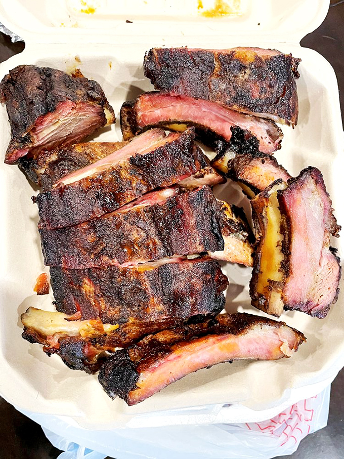 These ribs don't just fall off the bone—they practically leap into your mouth with that perfect bark and smoke ring that haunts barbecue dreams.