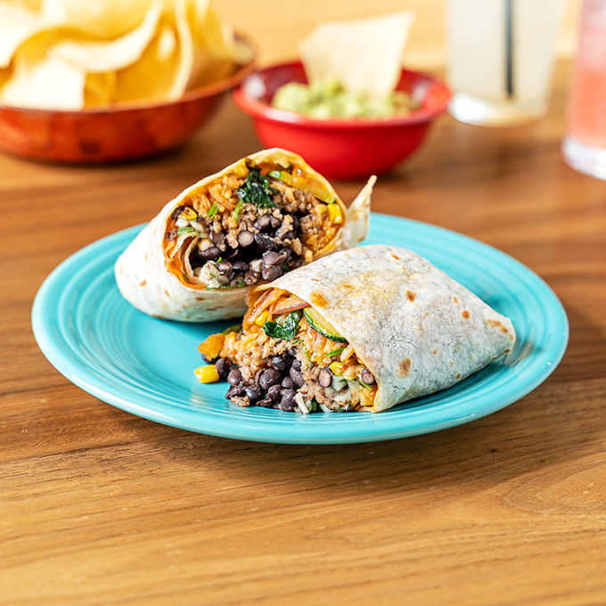 Architecture in food form. This black bean burrito isn't just a meal&mdash;it's engineering perfection with layers of flavor that somehow stay contained in that tortilla miracle.
