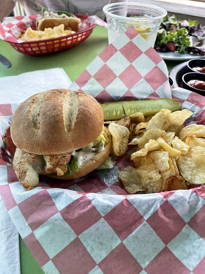 The sandwich that launched a thousand road trips. Golden-crusted grouper nestled in a fresh roll with house-made chips that crackle with each bite.