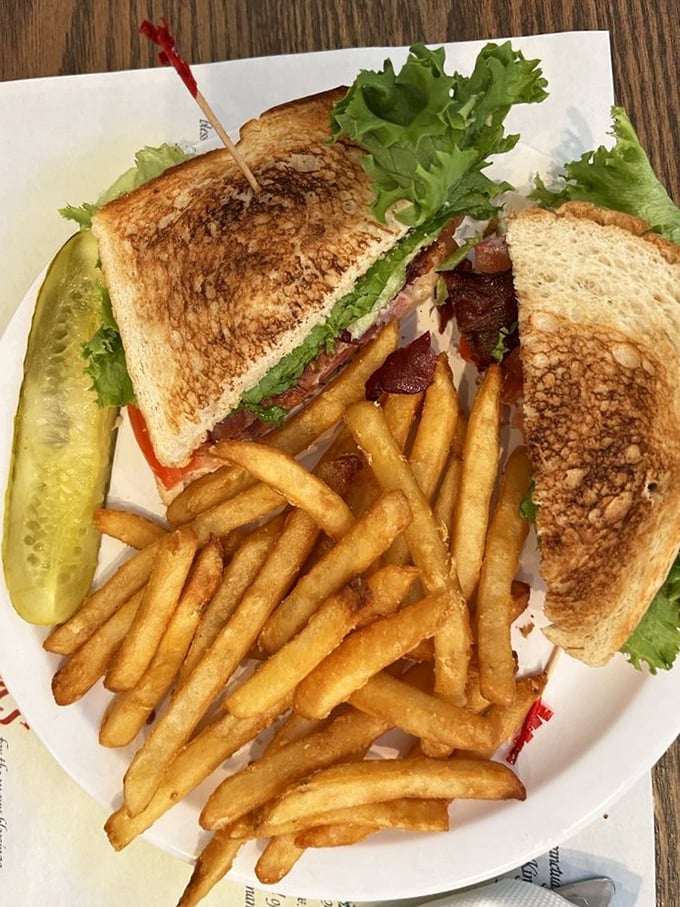 This isn't just a sandwich; it's edible architecture with perfectly toasted bread, crisp lettuce, and bacon that actually tastes like it came from a pig.