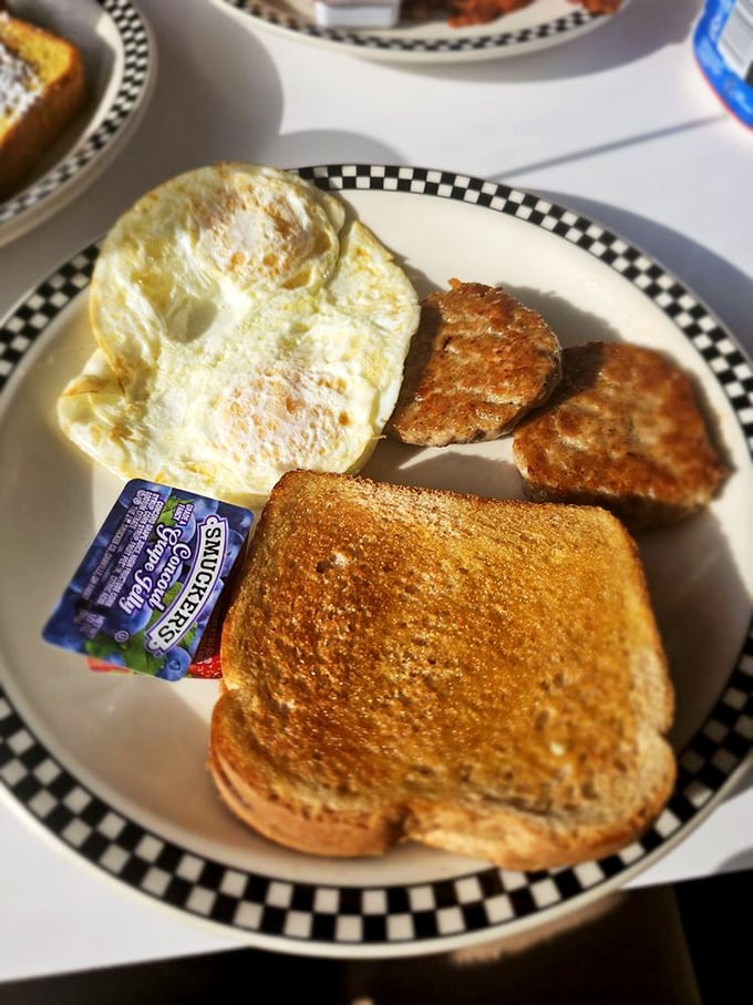 Breakfast perfection doesn't need filters—just perfectly cooked eggs, golden toast, and sausage patties that would make your grandmother nod in approval.