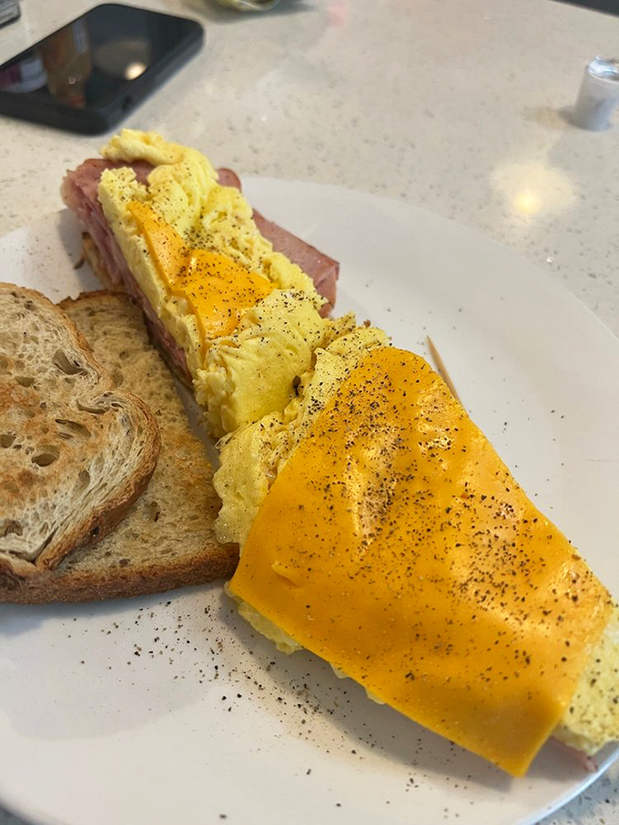 Behold the humble breakfast sandwich&mdash;where perfectly peppered eggs and ham create a morning masterpiece that makes fancy brunch spots seem unnecessarily complicated.