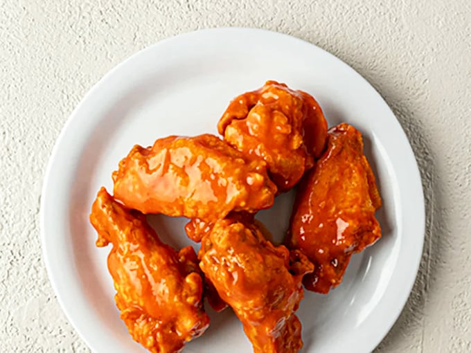 These buffalo wings might not be what nonna made in the old country, but they deliver that perfect crispy-saucy balance that makes you forget you're in a pasta joint.