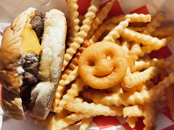This isn't just a cheeseburger &ndash; it's roadside philosophy on a bun, complete with a smiling potato friend who seems equally delighted to meet you.
