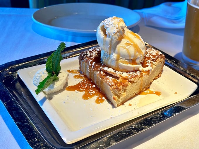 Butter cake that makes grown adults fight for the last bite, topped with ice cream melting into warm perfection like Florida sunshine on vacation.