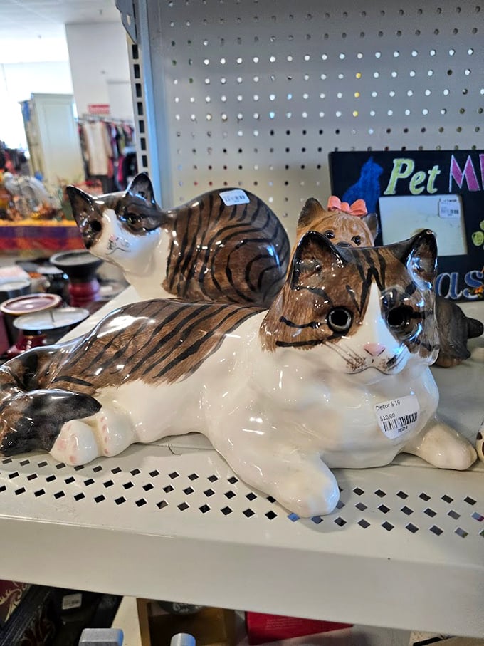 These ceramic felines aren't just decorations&mdash;they're the unofficial guardians of the knickknack section, judging your thrifting choices with glazed eyes.