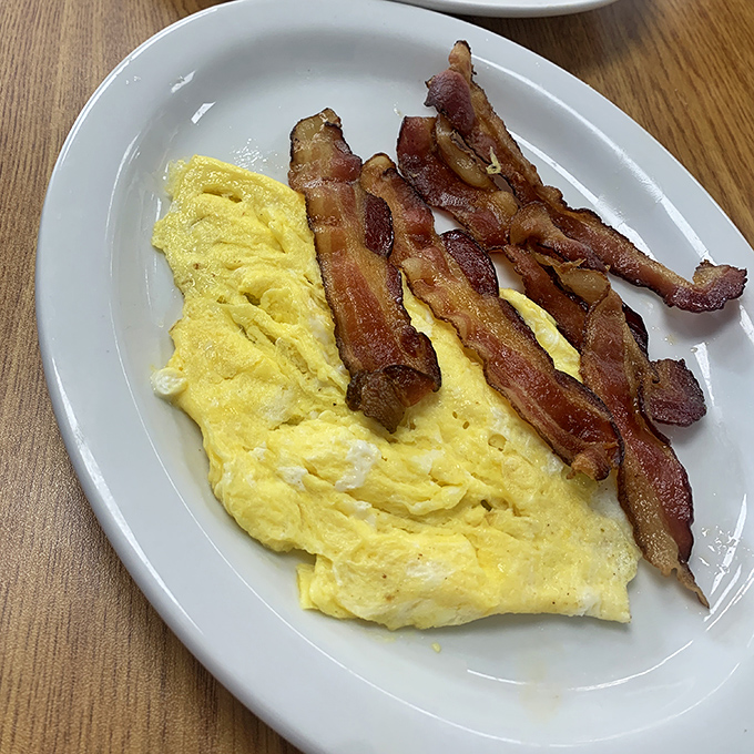 Scrambled eggs that actually taste like eggs should, paired with bacon cooked to that perfect point between chewy and crisp. Breakfast fundamentals mastered.