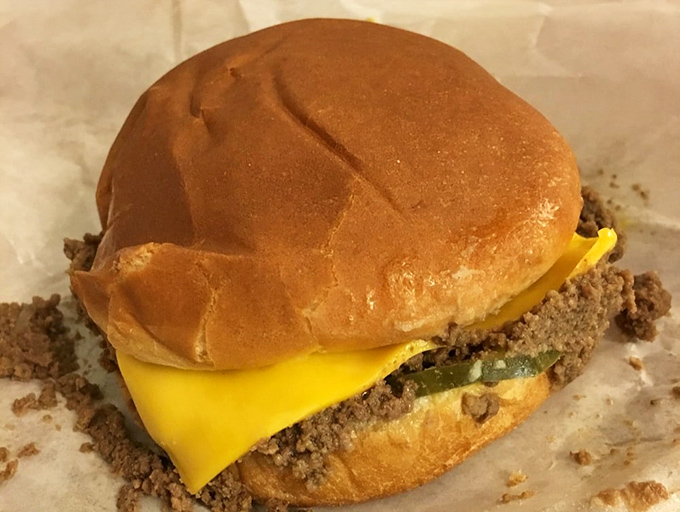 The star of the show: a loose meat sandwich with cheese that doesn't need architectural height or garnishes to achieve greatness.