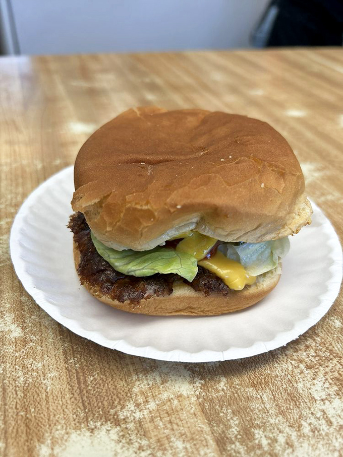 This isn't just a cheeseburger; it's edible evidence that simplicity—a thin patty with perfectly melted cheese—often trumps fancy culinary gymnastics.