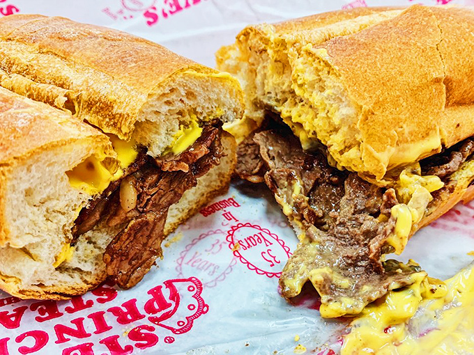 Behold the crown jewel: thinly-sliced ribeye embraced by molten cheese on a perfect roll. This isn't just a sandwich; it's Philadelphia's soul made edible.