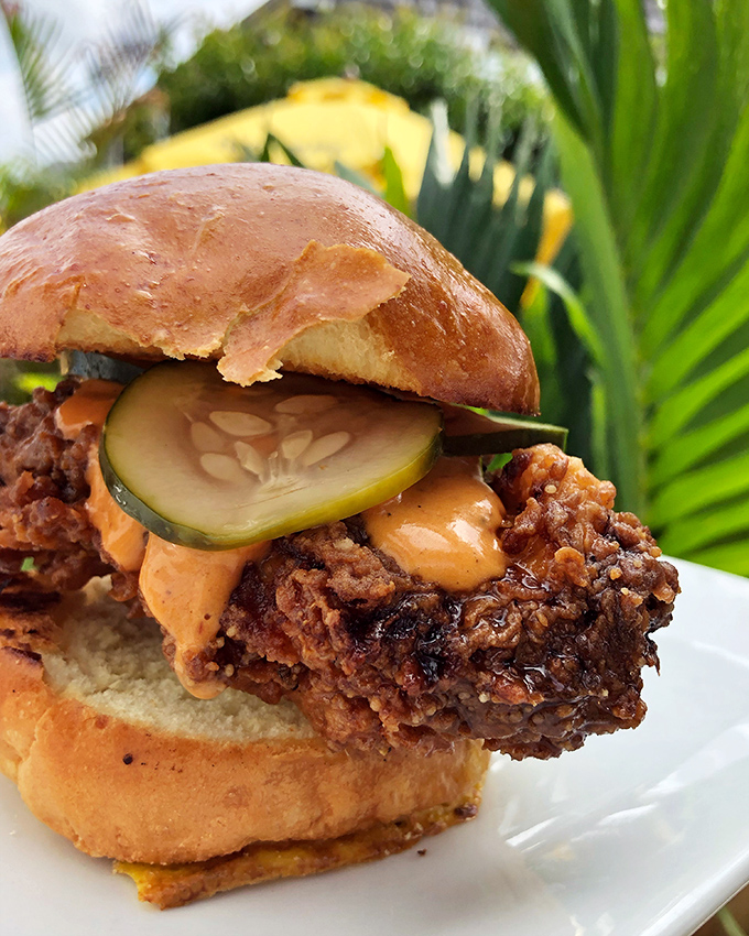 Behold the chicken sandwich that proves sometimes the best comfort food comes from the most colorful, unassuming beach town spots.