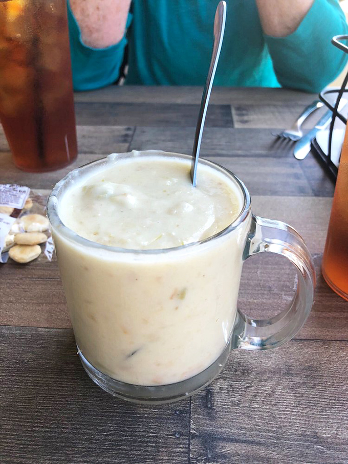 A mug of creamy seafood chowder awaits, promising warmth and comfort with each spoonful &ndash; liquid gold for the seafood lover's soul.