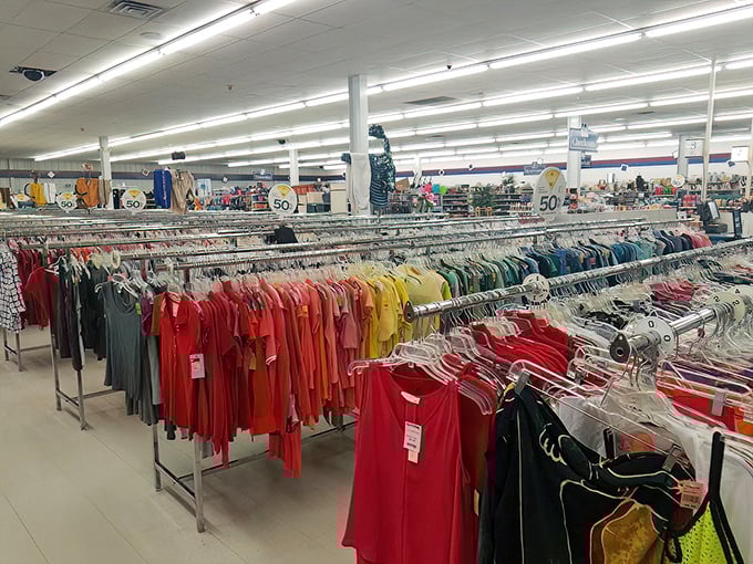 A rainbow of possibilities hangs in perfect order. Wisconsin's practical fashion sense means these racks hold barely-worn gems waiting for their second act.