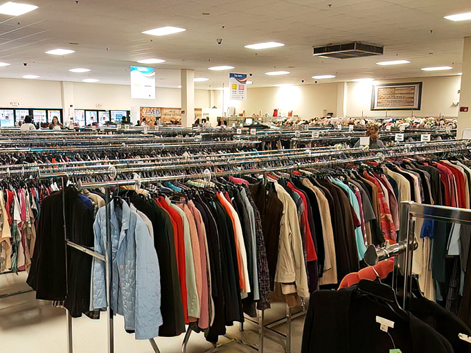 A rainbow of possibilities hangs in perfect formation. Each garment waits patiently for its second chance at fashion greatness.