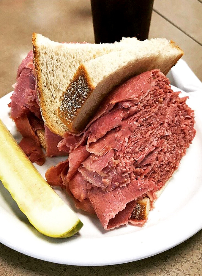 Architecture in sandwich form. This towering monument of corned beef makes skyscrapers jealous&mdash;the pickle stands guard like a sentry at the gates of flavor heaven.