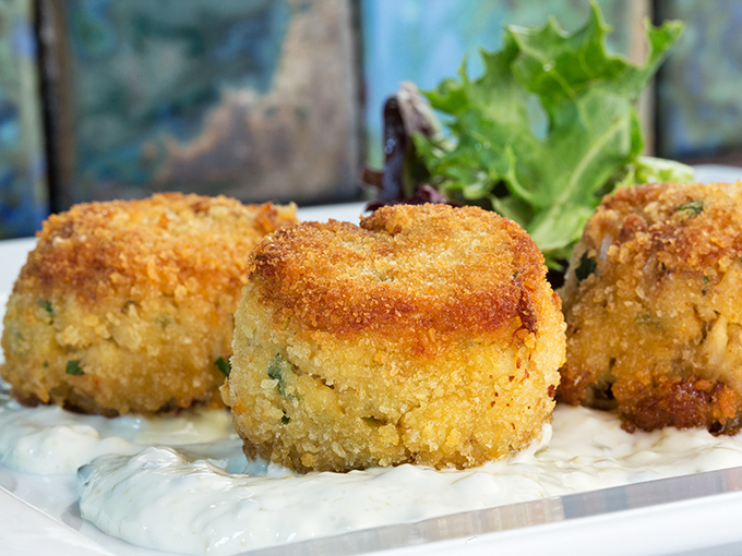 These golden crab cakes aren't just appetizers&mdash;they're an opening act that threatens to upstage the headliner. Crispy exterior, heavenly inside.