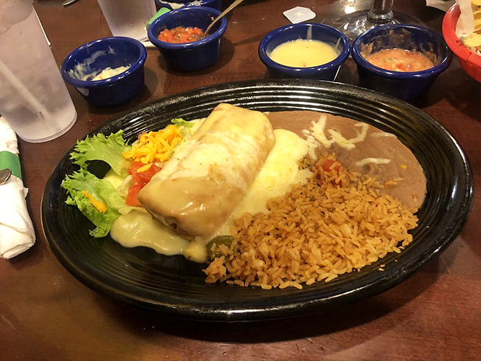 This isn't just a burrito&mdash;it's a work of art. Smothered in creamy sauce and nestled beside perfectly seasoned rice and beans, it's comfort food that speaks fluent Spanish.