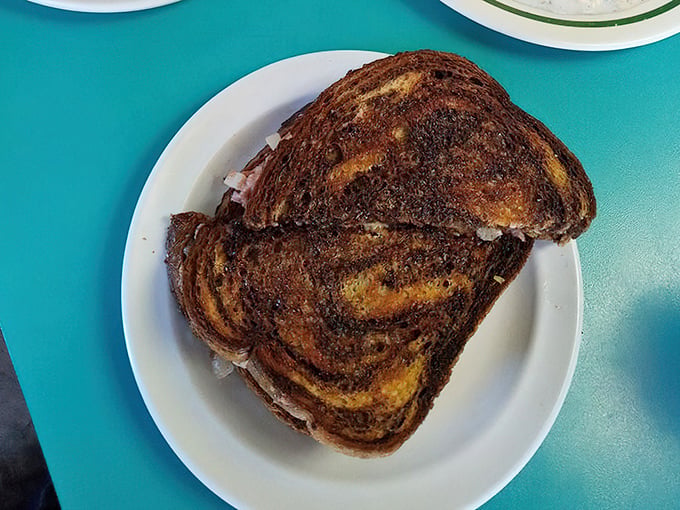 The Reuben arrives like a work of art &ndash; marble rye toasted to perfection, with corned beef peeking out as if to say "You made the right choice."