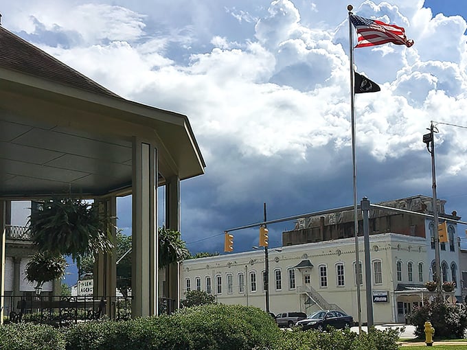 The heart of downtown Eufaula, where American flags wave and historic buildings remind us that some places refuse to surrender to cookie-cutter modernization.