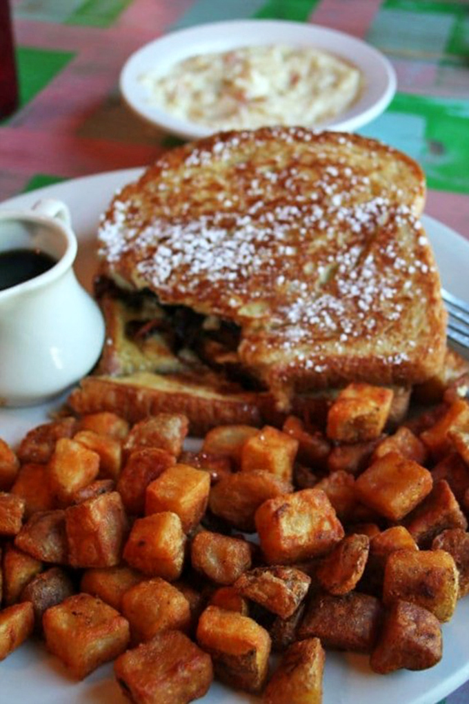 This isn't just French toast&mdash;it's a golden-crusted island surrounded by a sea of perfectly crisped home fries, a breakfast worth setting your alarm for.