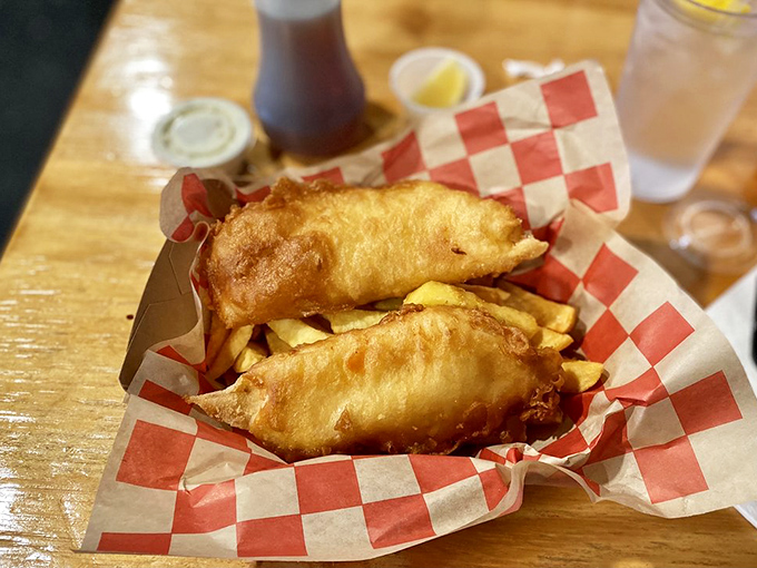 Golden-battered fish perched atop a bed of thick-cut chips &ndash; this isn't fast food, it's a slow, savory vacation for your taste buds.