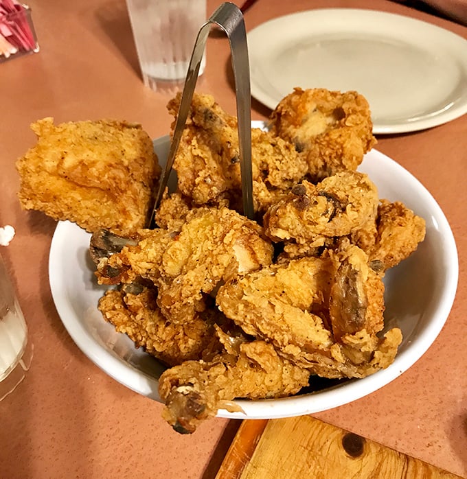 Golden-brown perfection that makes time stand still. This isn't just fried chicken—it's edible poetry with a satisfyingly audible crunch.