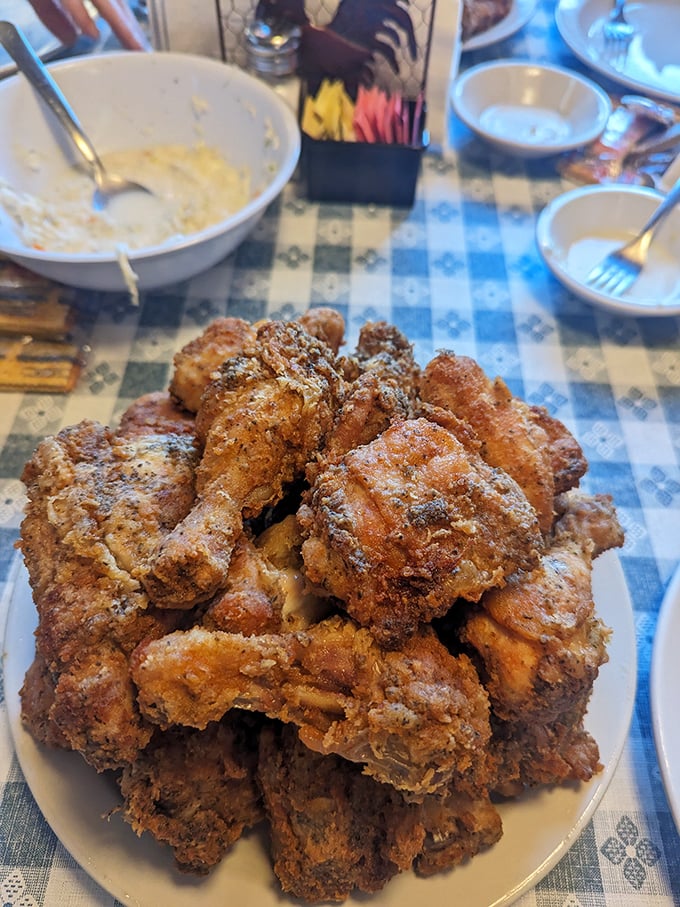 Golden-brown perfection piled high &ndash; this isn't just fried chicken, it's an edible monument to patience and proper seasoning.