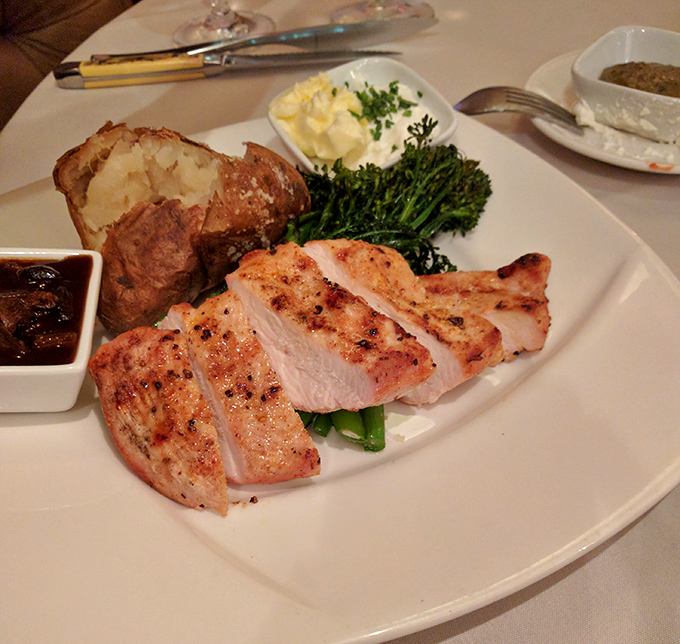 Chicken so perfectly grilled it makes you wonder if poultry has been seriously underestimated all these years. The baked potato isn't sulking either.